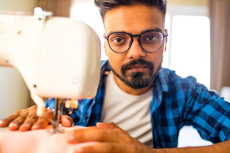 Arabian Man Designer Sewing Clothes on Sewing Machine in Studio ...