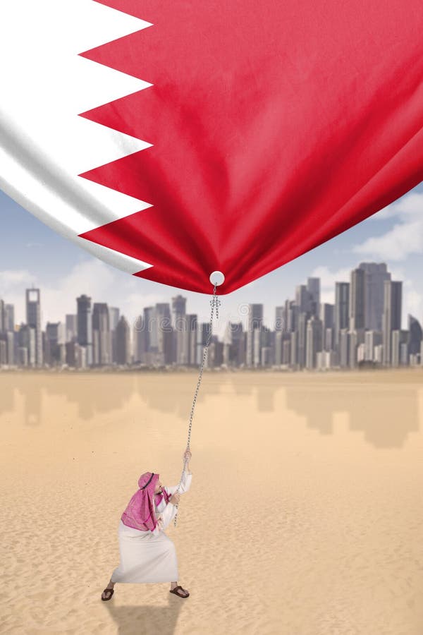 Arabian Man Pulls Flag of Bahrain Stock Photo - Image of bahrain, male ...
