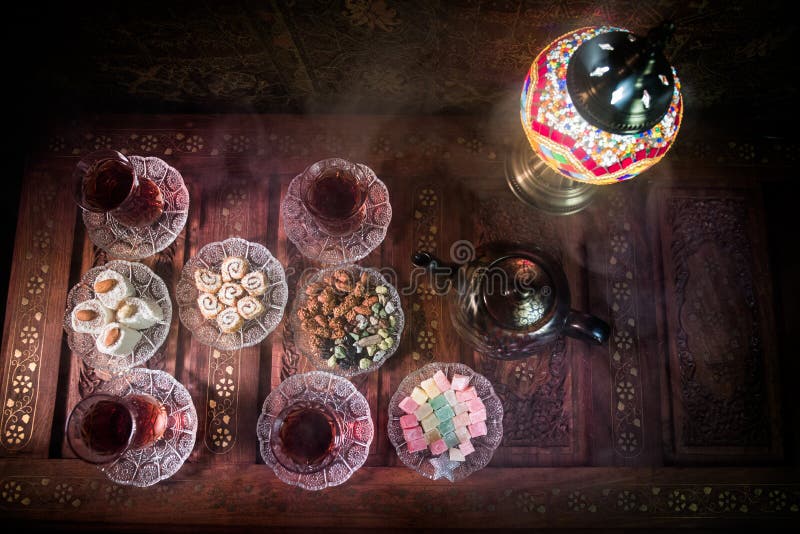 Arabian Tea in Glass with Eastern Snacks on Vintage Wooden Surface ...