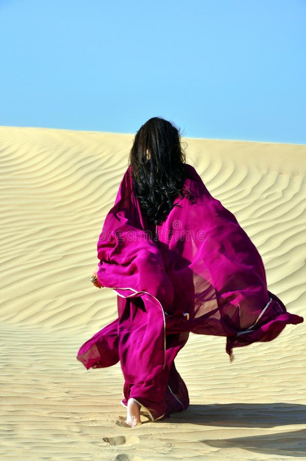 Arabic Brunette Woman Walking through the Desert Stock Photo - Image of ...