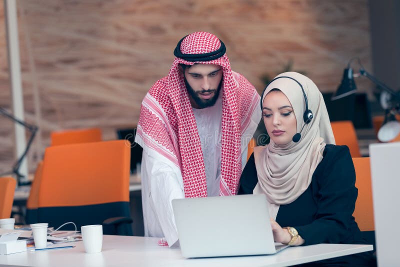 Arabic Business Couple Working Together on Project at Modern Startup ...