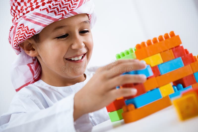 Arabic little boy playing stock photo. Image of blocks - 41325726