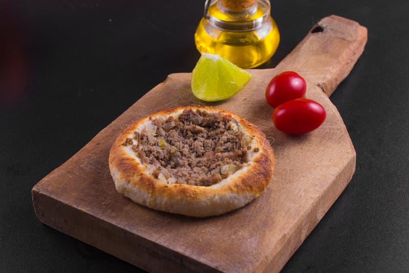 Arabic Meat Sfiha Over a Wooden Table Stock Photo - Image of meat ...