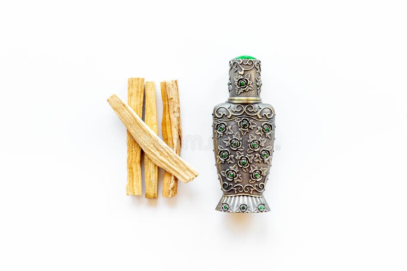 Arabic Oud Oil Perfume in Silver Bottle with Crystals and Sticks of ...