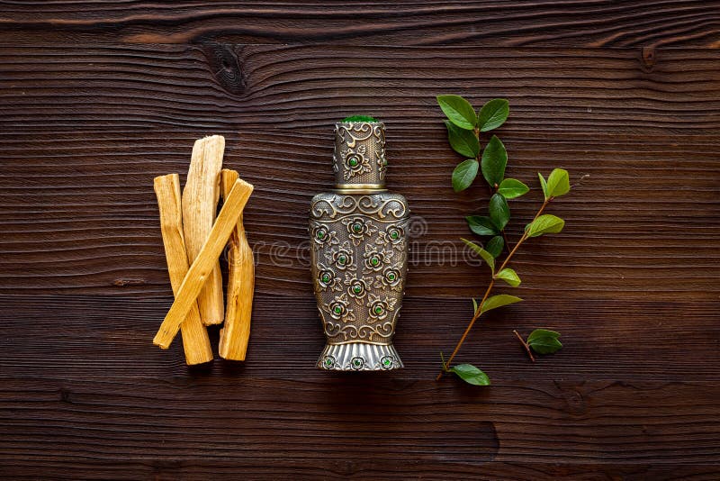 Arabic Oud Oil Perfume in Silver Bottle with Crystals and Sticks of ...