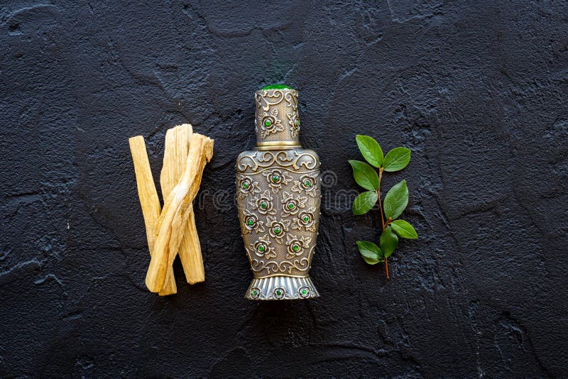 Arabic Oud Oil Perfume in Silver Bottle with Crystals and Sticks of ...