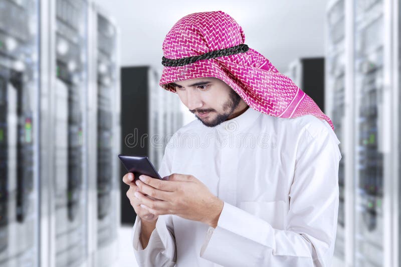 Arabic Person with Smartphone in Server Room Stock Photo - Image of ...