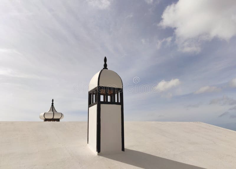 An Arabic Roof with Tipical Chimney and a Blue Sky a Little Cloudy ...