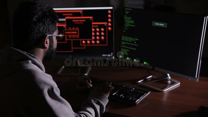 Arabic it Specialist Working on Computer at Night. Hacker Breaking ...