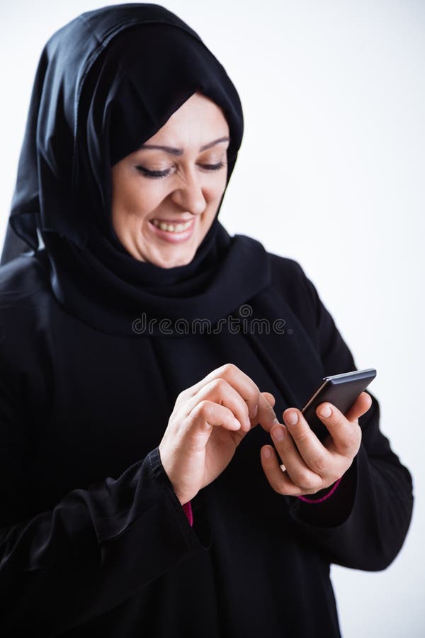Arab Saudi Emirates Smiling Woman Using a Smart Phone Stock Image ...