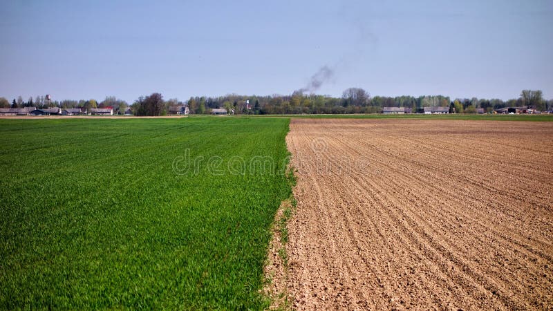 Arable Land with Village in the Background Stock Image - Image of grain ...