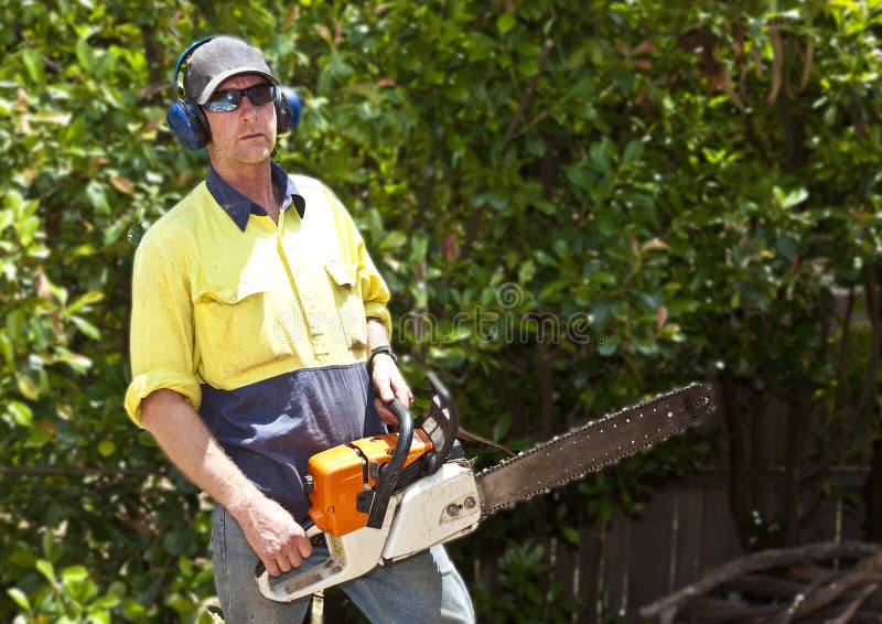 Arborist with chain saw stock image. Image of spikes - 22743473