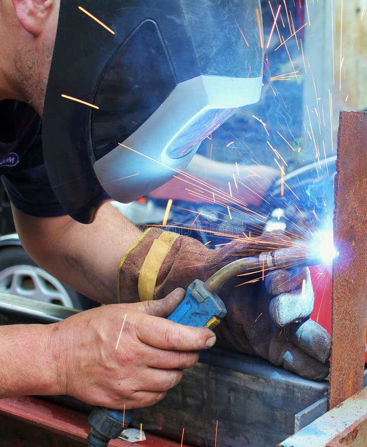 Arc Welder Wearing Welding Mask with Welding Spark Stock Photo - Image ...