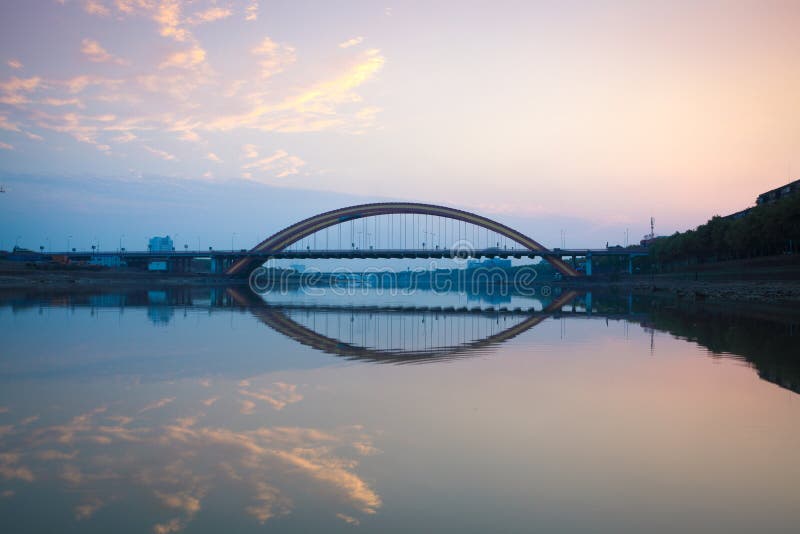 Arch Highway Bridge at Sunset Stock Image - Image of clouds, scene ...