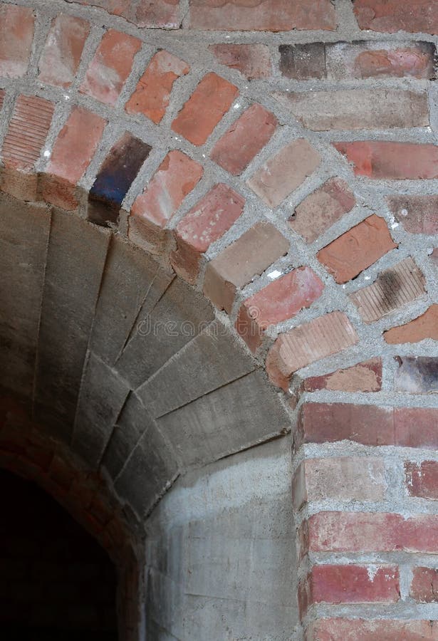 An arch made of red bricks stock photo. Image of wall - 254582534