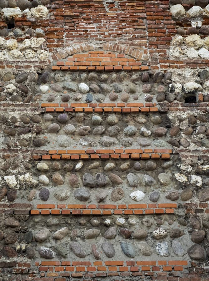 The Arch in the Medieval Wall is Laid with Large Cobblestones and Red ...