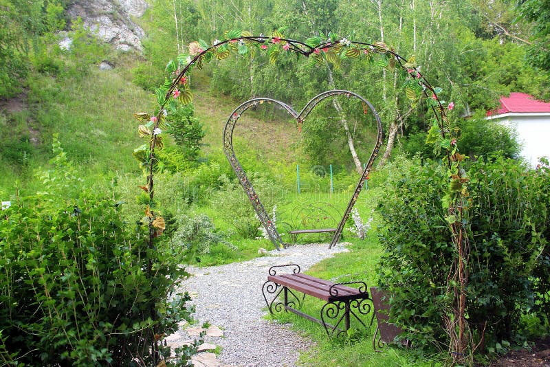 Arch in the park stock photo. Image of green, arch, heart - 104067178