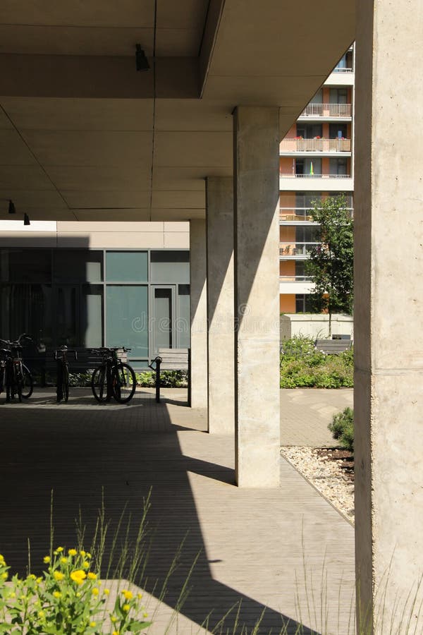 An Arch Passage Below the Modern Building. Rectangular Columns Hold the ...