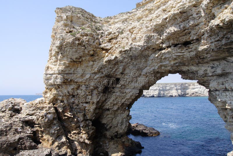 Arch in a rocky cliff stock photo. Image of cliff, summer - 8803170