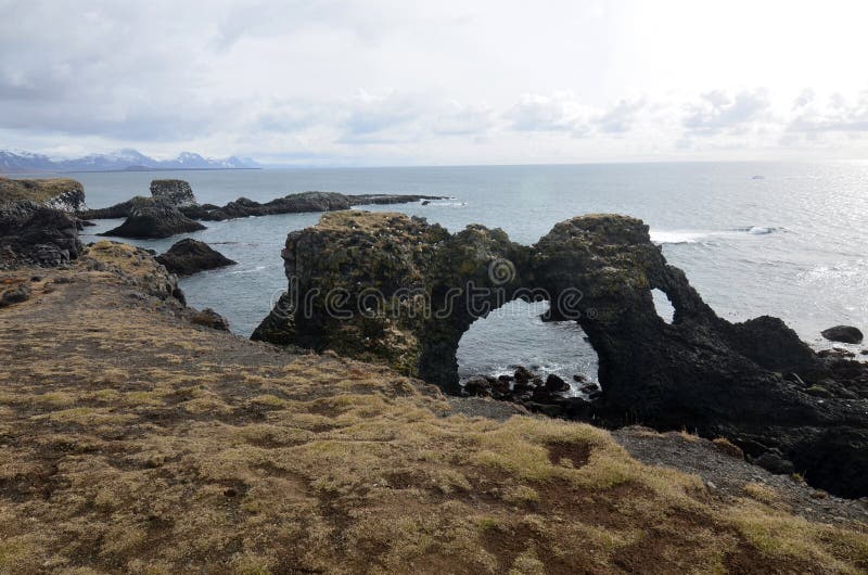 Arch Shaped Rock Located on the Coast of Arnarstapi Stock Photo - Image ...