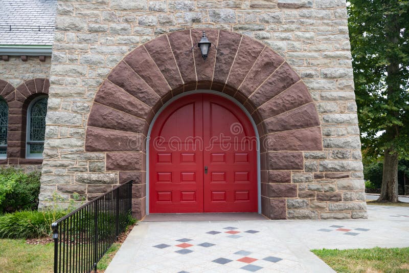 Arch in a Stone Wall with Red Wooden Double Gates Stock Image - Image ...