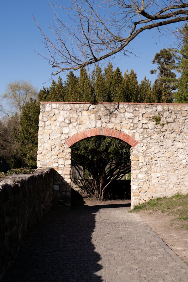 Arch in Wall Brick Wall in Green Tree Park Stock Image - Image of ...