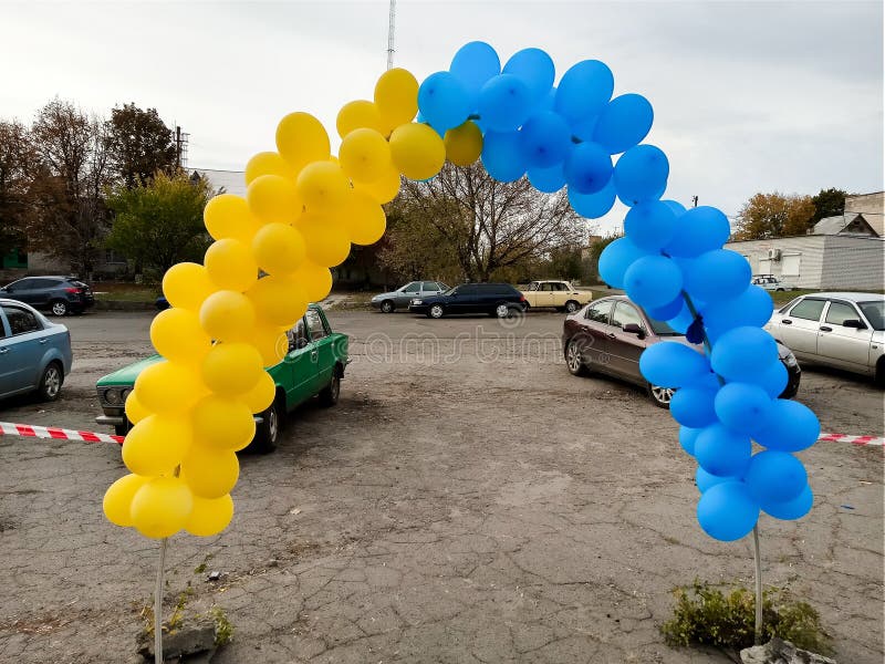 Arch with Yellow-blue Balloons Taken from the Side Stock Photo - Image ...