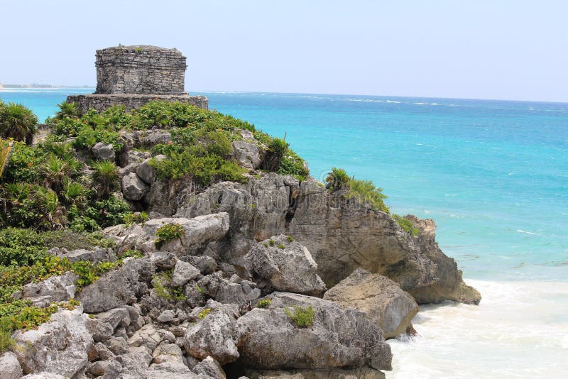 The Archaeological Ruins of Tulum, Mexico Together with Rocks and Blue ...
