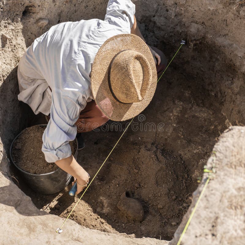 Archaeology - Archaeologist Digging Up Ancient Pottery Stock Photo ...