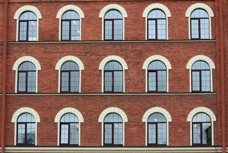 Arched brick house windows stock photo. Image of loft - 115907346