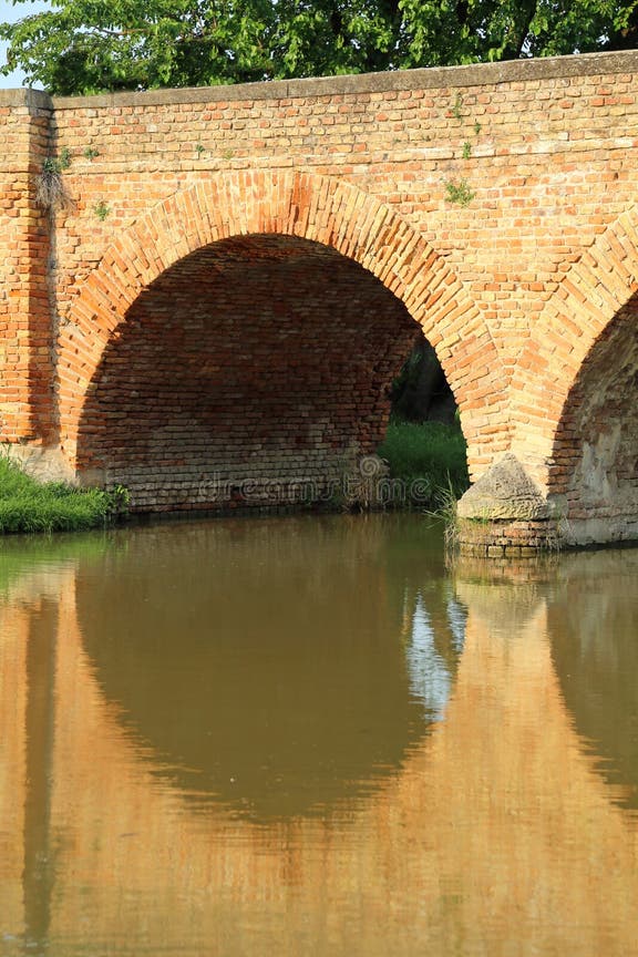 Arched Bridge Made with Bricks with the River Stock Photo - Image of ...
