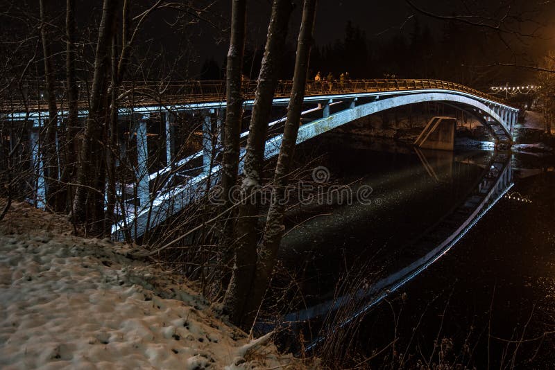 The Arched Bridge Over the Ogre River in the Winter Evening is ...