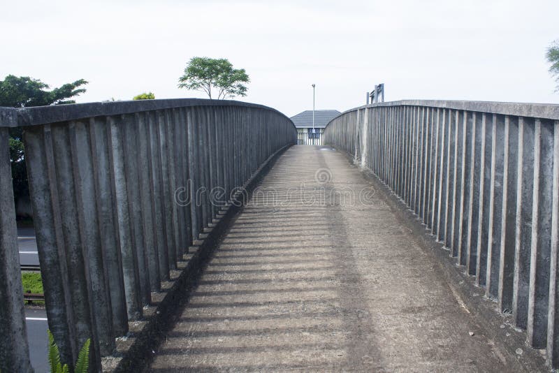 Arched Concrete Pedestrian Foot Bridge with Palisade Railing Stock ...