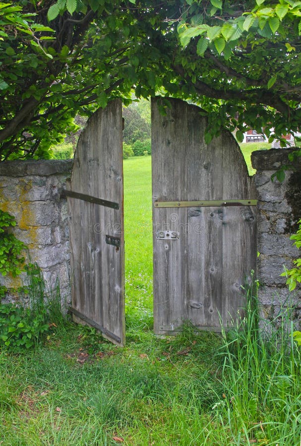 Arched Garden Door, Framed with Beech Hedge Stock Photo - Image of ...