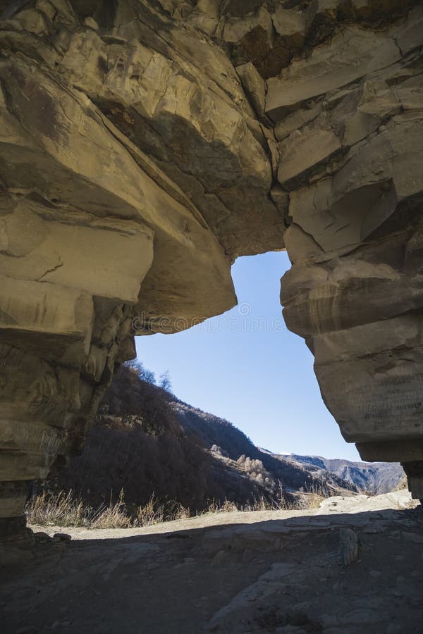 An Arched Opening or Tunnel in the Rocks through Which a Mountain ...