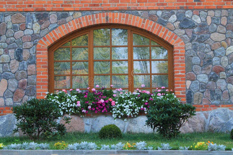 Arched window with flowers stock photo. Image of stone - 44627344