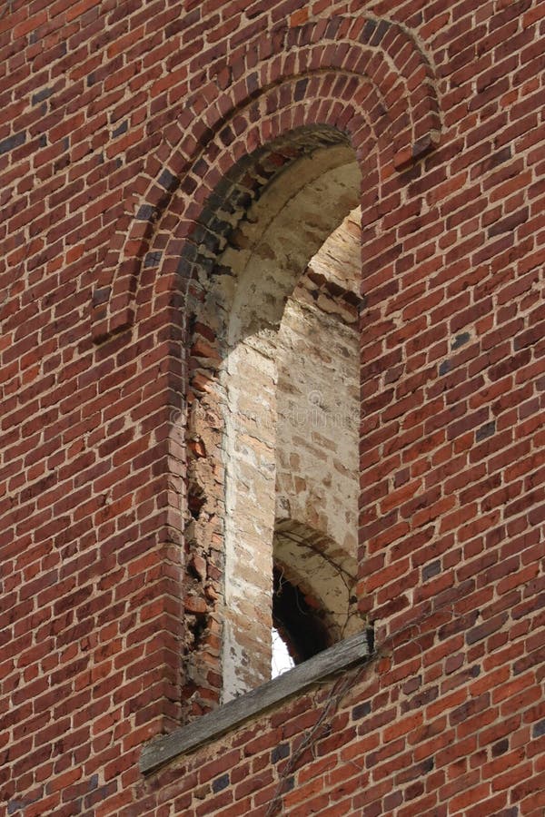 View of Interior White Bricks and Sunlight through Empty Arched Window ...