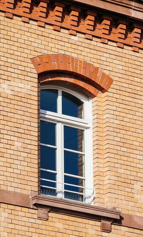 Arched Window with White Frame on Brick Facade Stock Photo - Image of ...