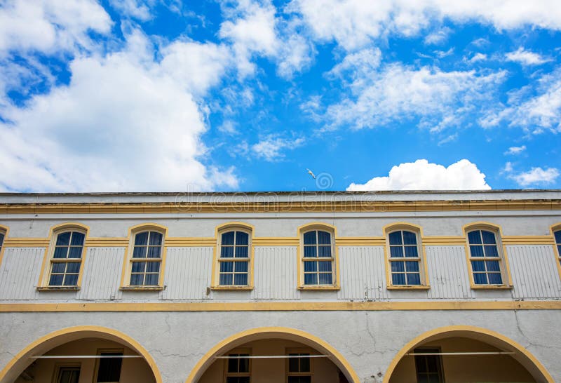 Arched Windowed Building and White Cloudy Blue Sky in the Summer Stock ...