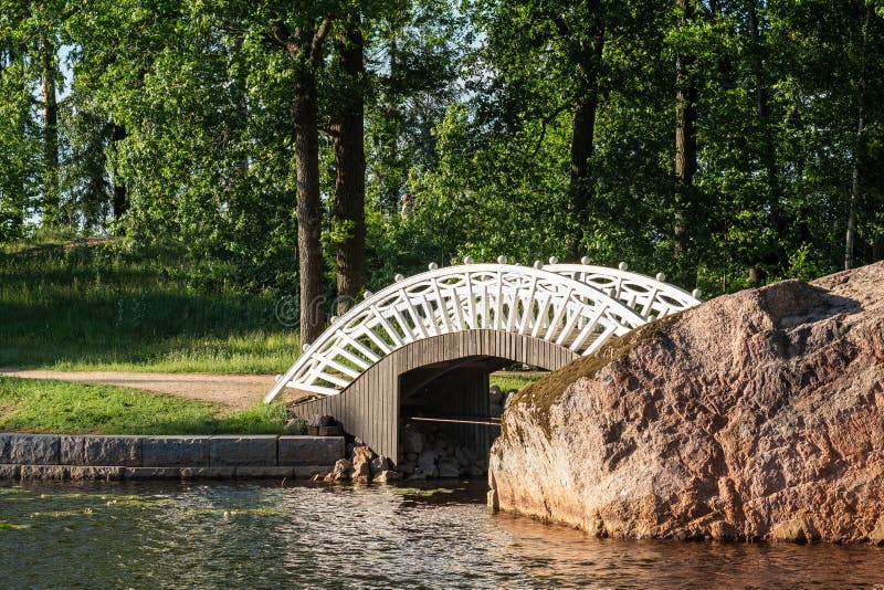 Arched Wooden Pedestrian Bridge in the Park Stock Photo - Image of ...
