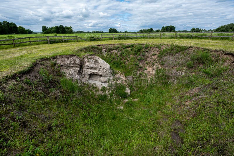 Archeological Pit Cave in the Ground in Meadow Stock Photo - Image of ...