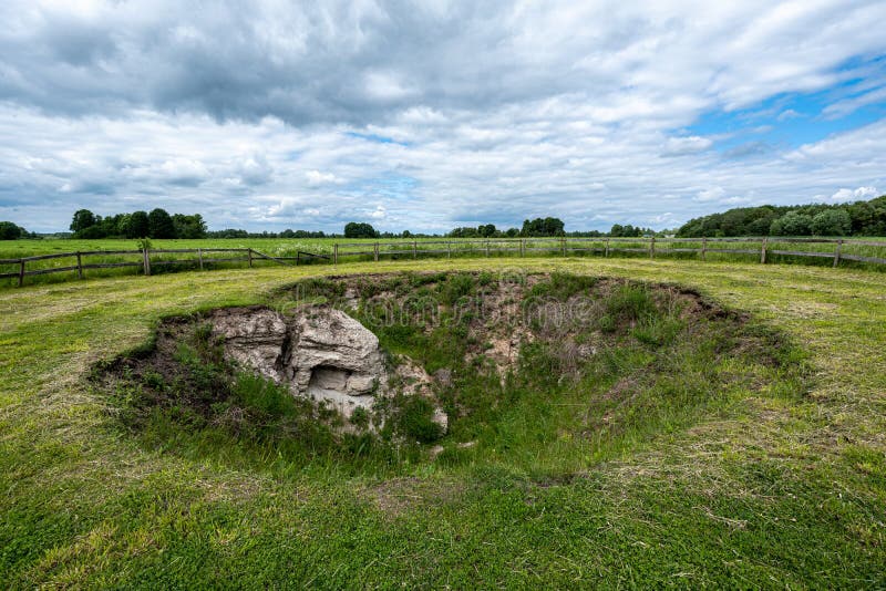 Archeological Pit Cave in the Ground in Meadow Stock Image - Image of ...