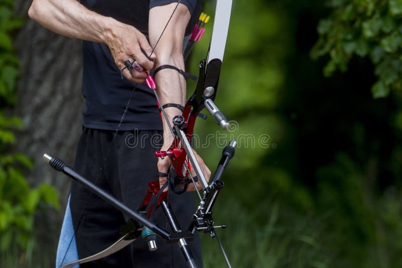 Archer Pulls on the Sport Bow String, Taking Aim at His Target at the ...