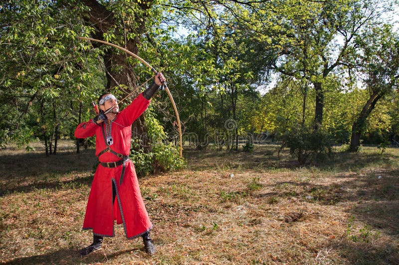 Archer pulls on the string stock photo. Image of male - 65531496
