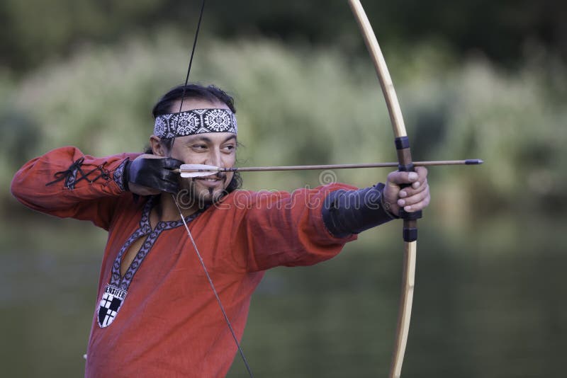 Archer pulls on the string stock photo. Image of mode - 65531498