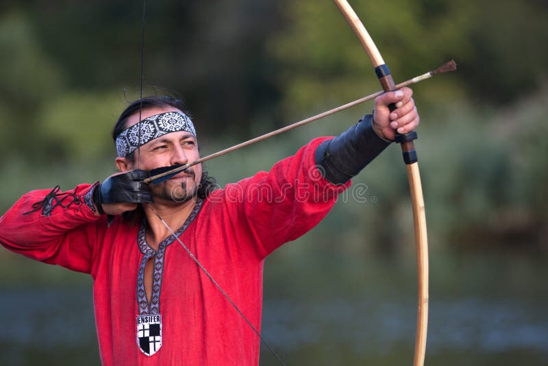 Archer pulls on the string stock photo. Image of string - 65531502