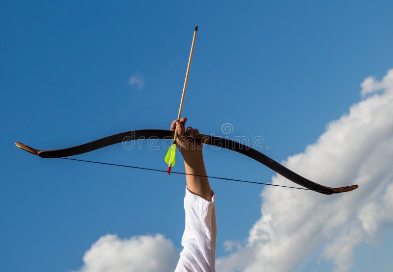 Archer in Traditional Clothes Shooting an Arrow Stock Photo - Image of ...
