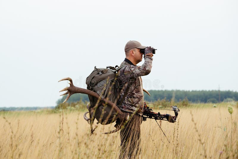 Archery Hunter Scouting for His Next Target Stock Photo - Image of ...