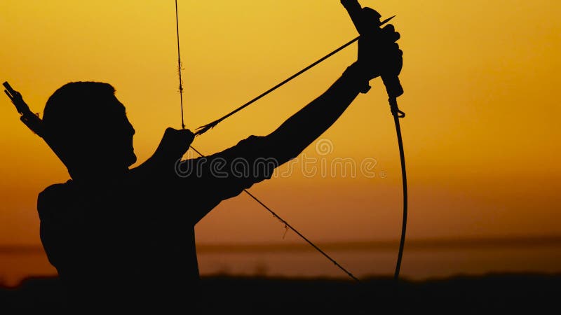 Archery Silhouette, Sun Sets Behind the Archer. Young Hunter. Stock ...
