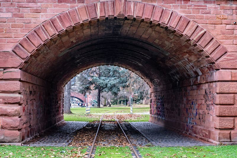 The Arches in an Old Brick Structure Allow a View into an Empty Field ...